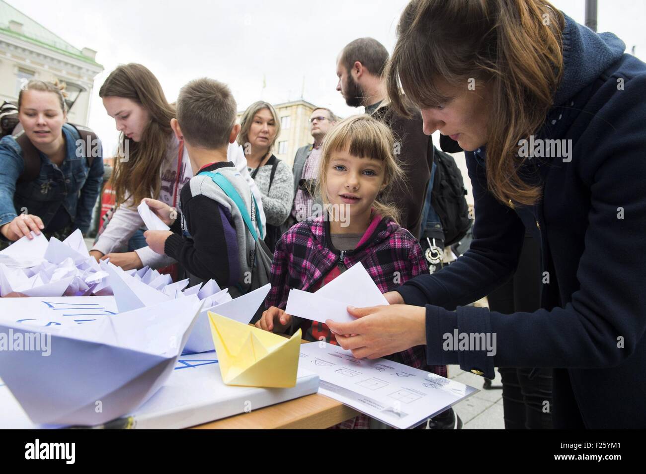 Vilnius, Lithuania. 12th Sep, 2015. People make paper boats during an ...
