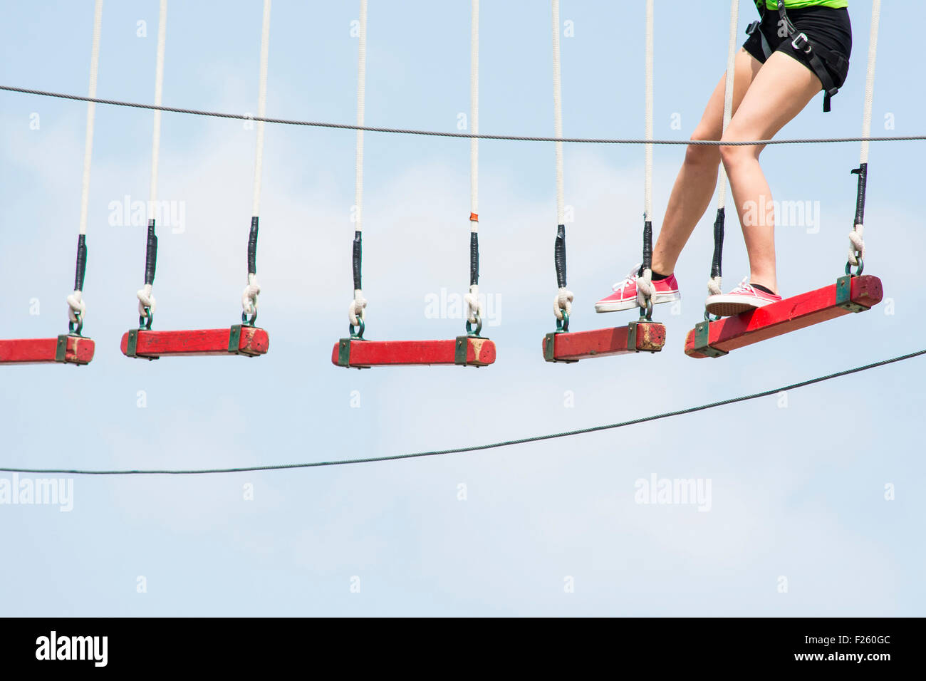 Bologna,Italy-May 31,2015:Group of people hanging on a equipped path ...