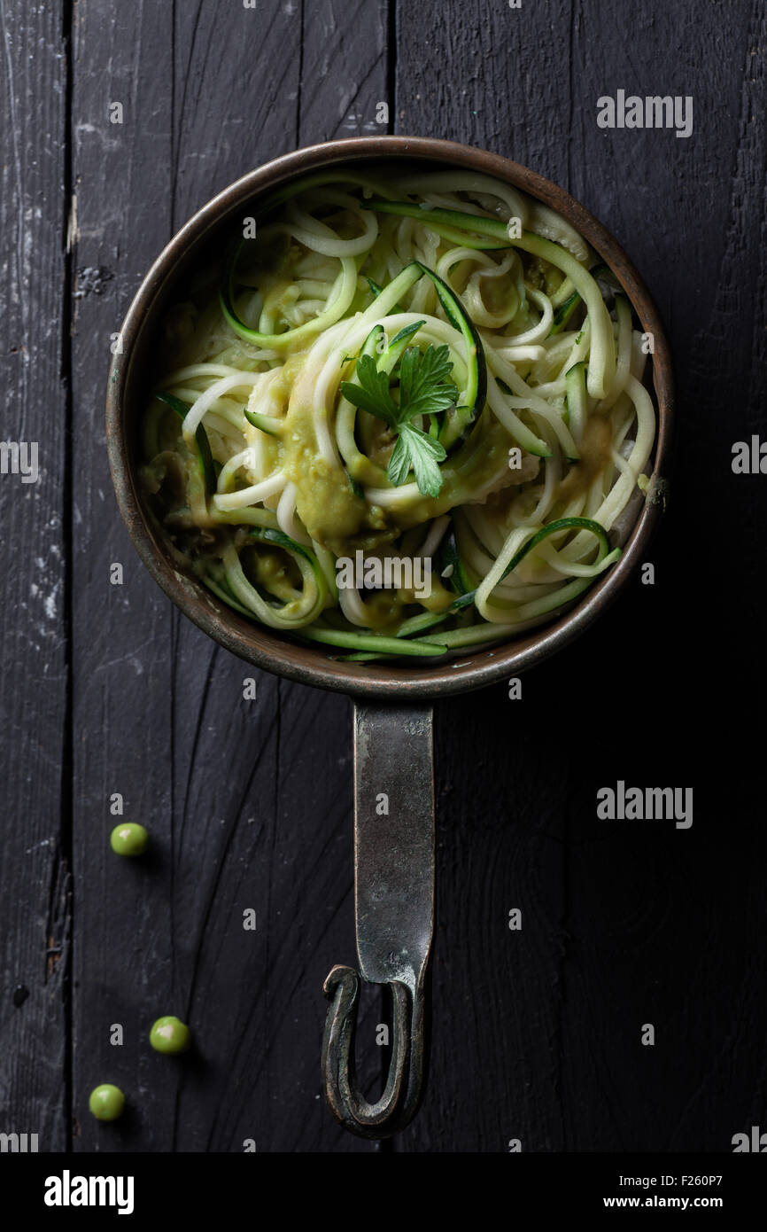 Courgette Spaghetti with Pea Sauce on Copper Pan Stock Photo - Alamy