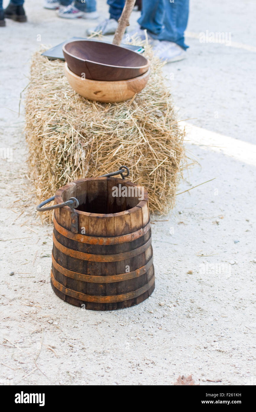 Wooden bucket and bale of hay Stock Photo - Alamy