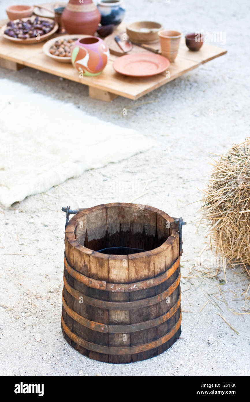 Wooden bucket and ceramic bowls Stock Photo - Alamy