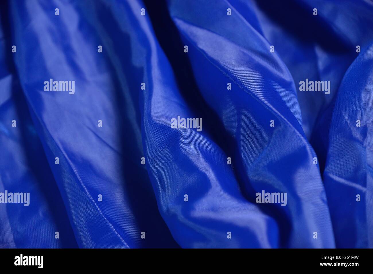 blue satin cloth with folds Stock Photo - Alamy