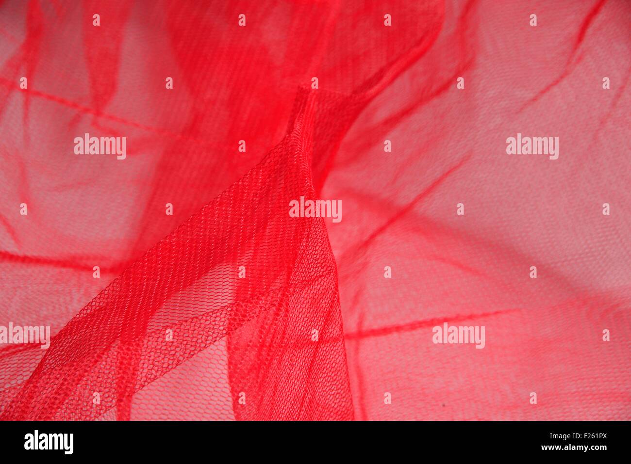 zoomed red organza material with folds Stock Photo - Alamy