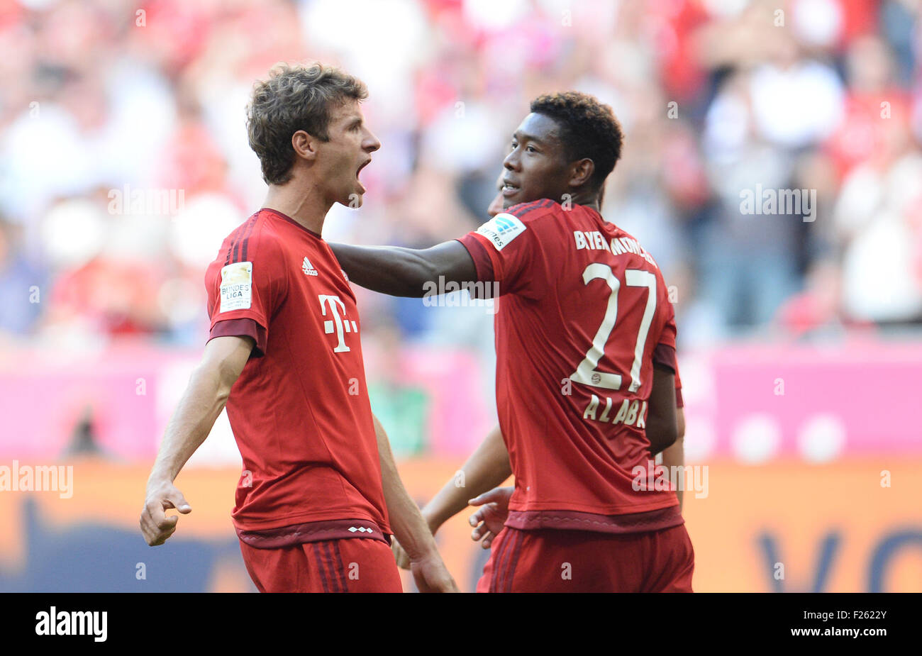 Munich, Germany. 12th Sep, 2015. Munich's Thomas Mueller (l) celebrates ...