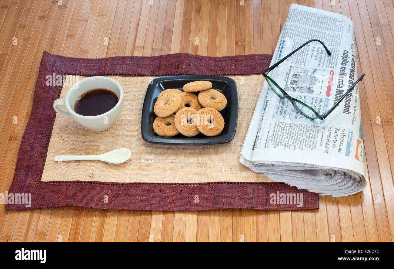 Breakfast with cookies coffee and newspaper Stock Photo - Alamy