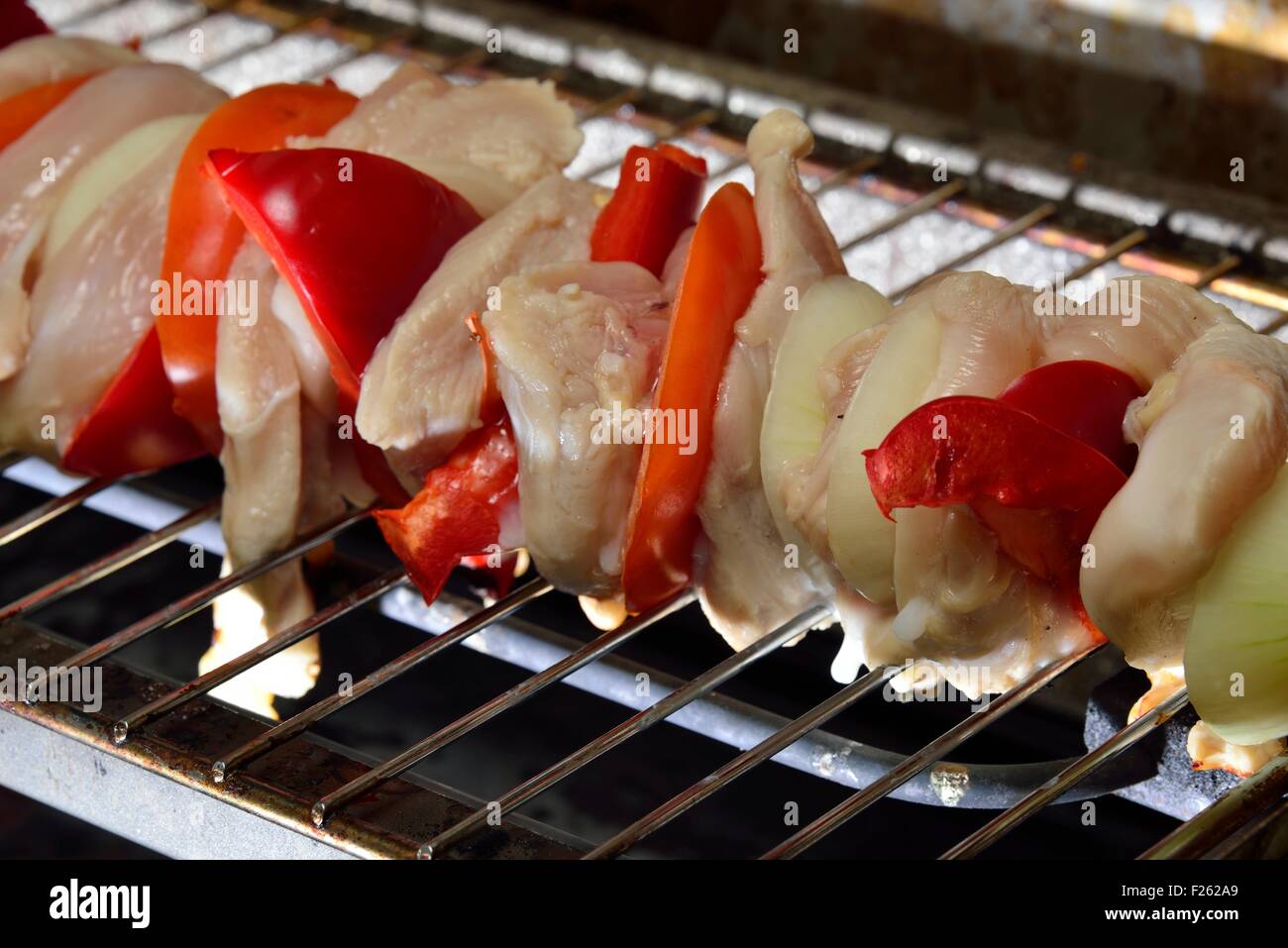 raw chicken barbecue grilled with peppers, tomatoes, onionswith peppers ...