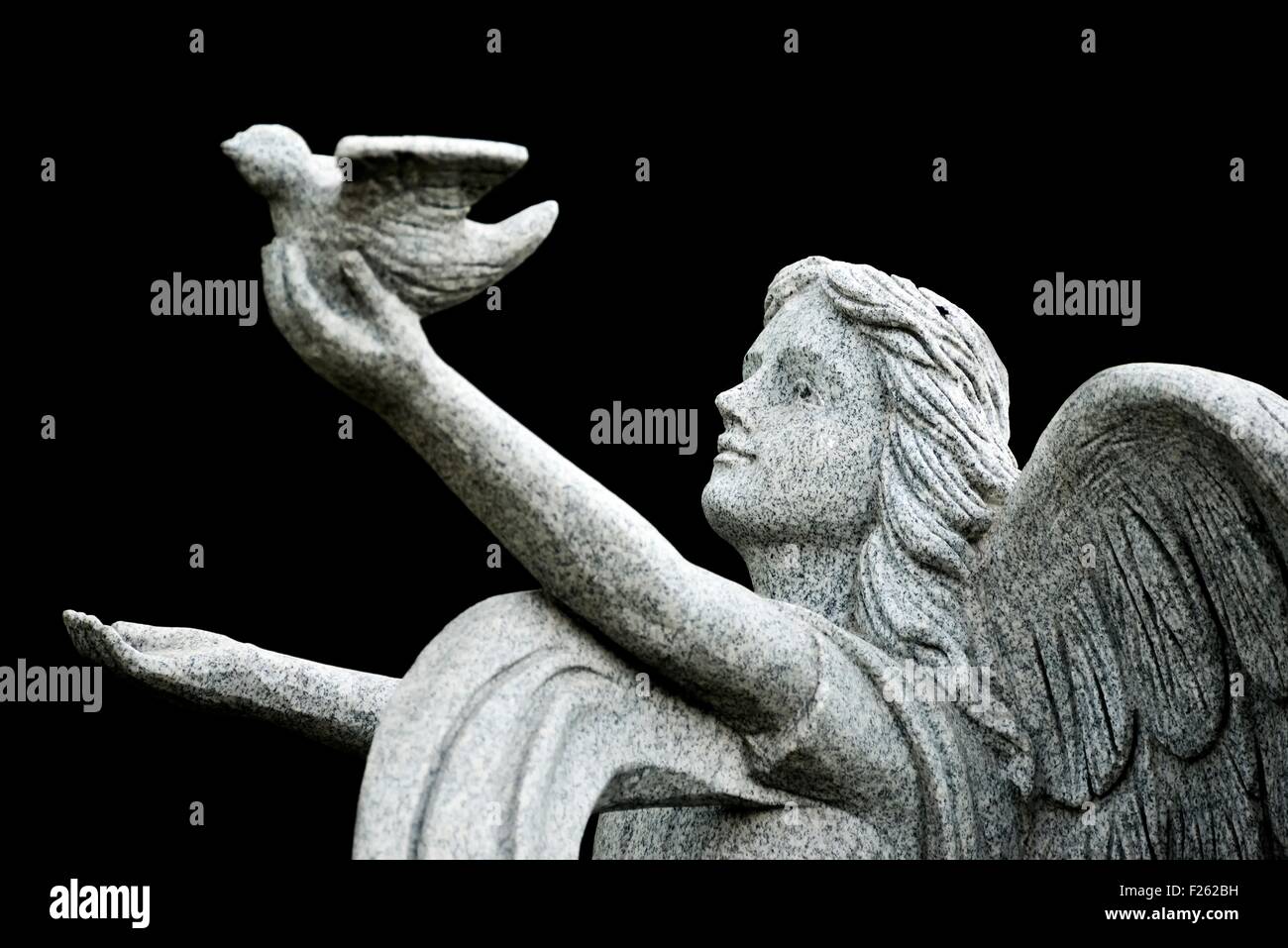 stone marble Angel praying for peace near church Stock Photo - Alamy