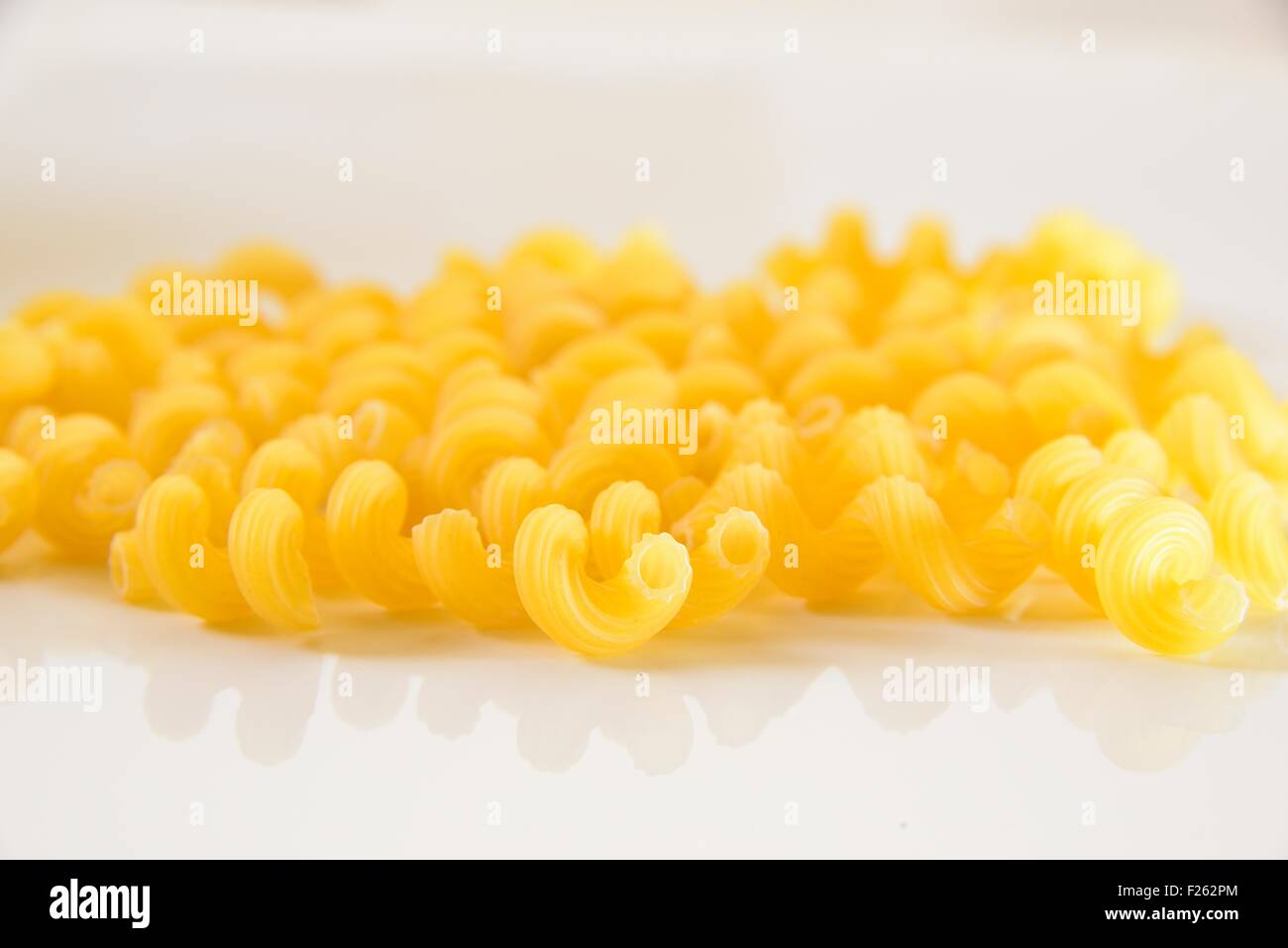 cooking raw yellow macaroni (pasta Stock Photo - Alamy