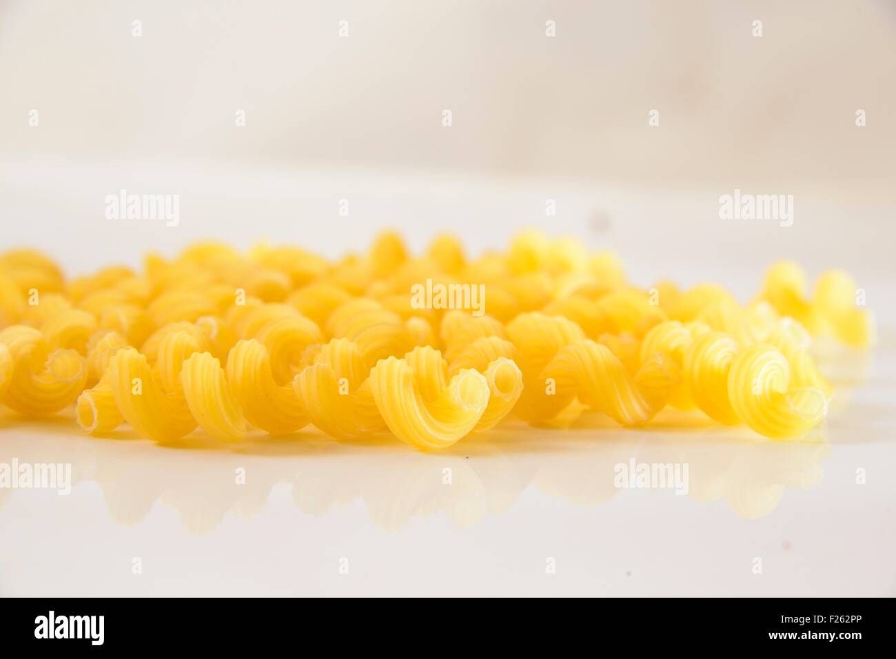 cooking raw yellow macaroni (pasta Stock Photo - Alamy