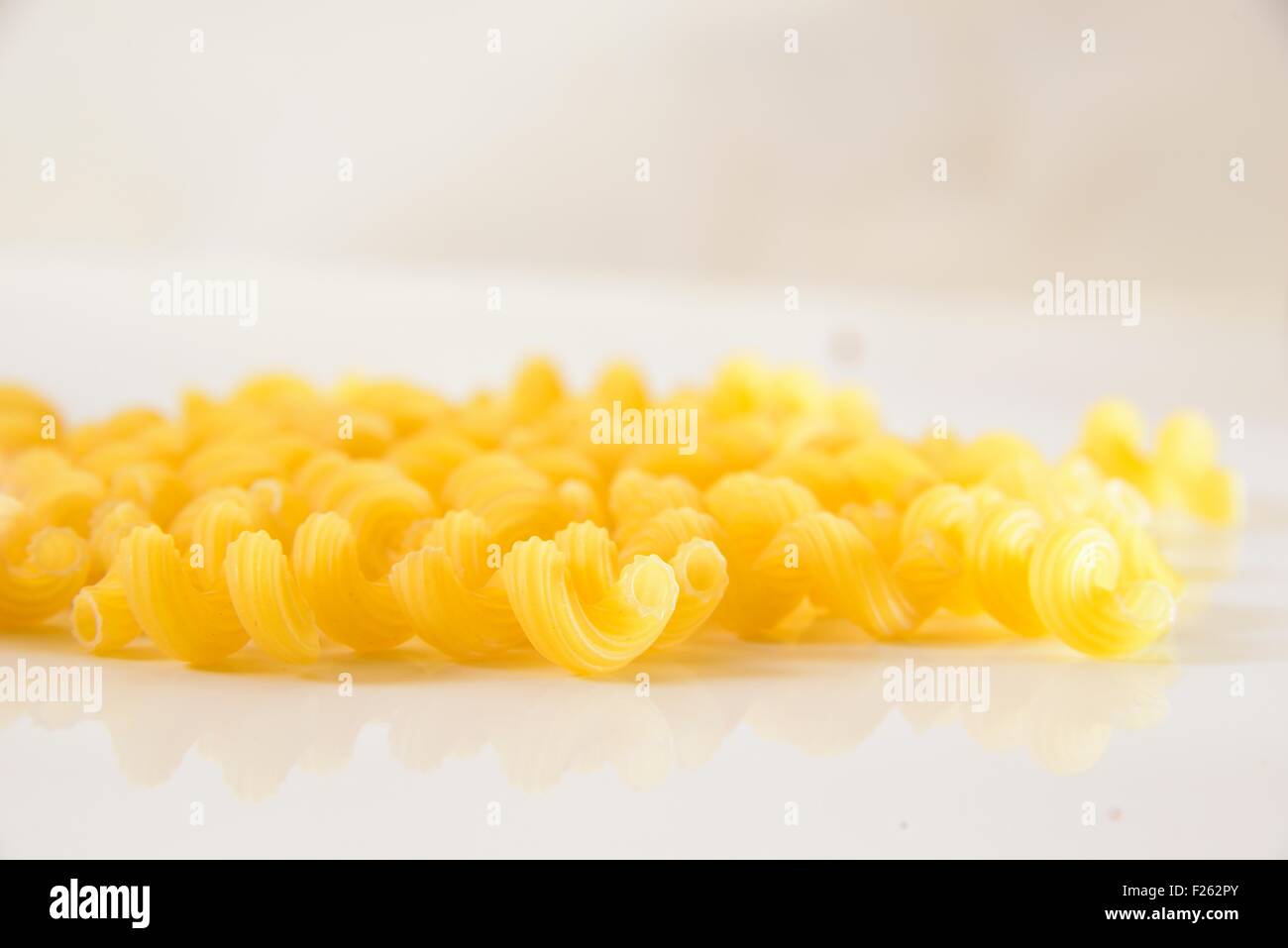 cooking raw yellow macaroni (pasta Stock Photo - Alamy