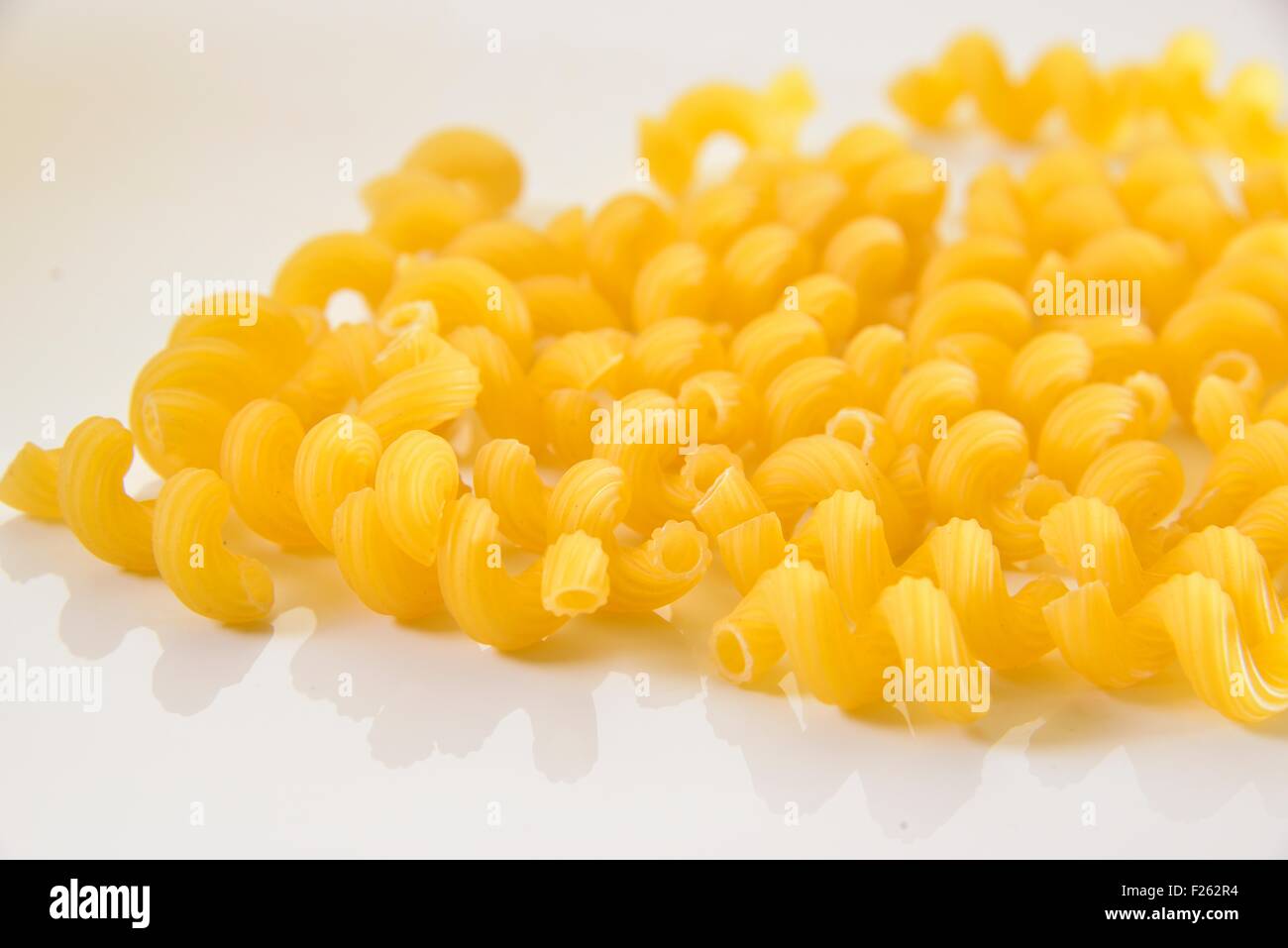 cooking raw yellow macaroni (pasta Stock Photo - Alamy