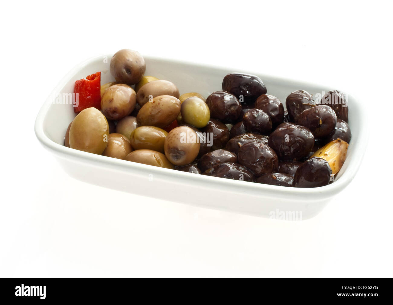 Olives inside a saucer on white background Stock Photo - Alamy