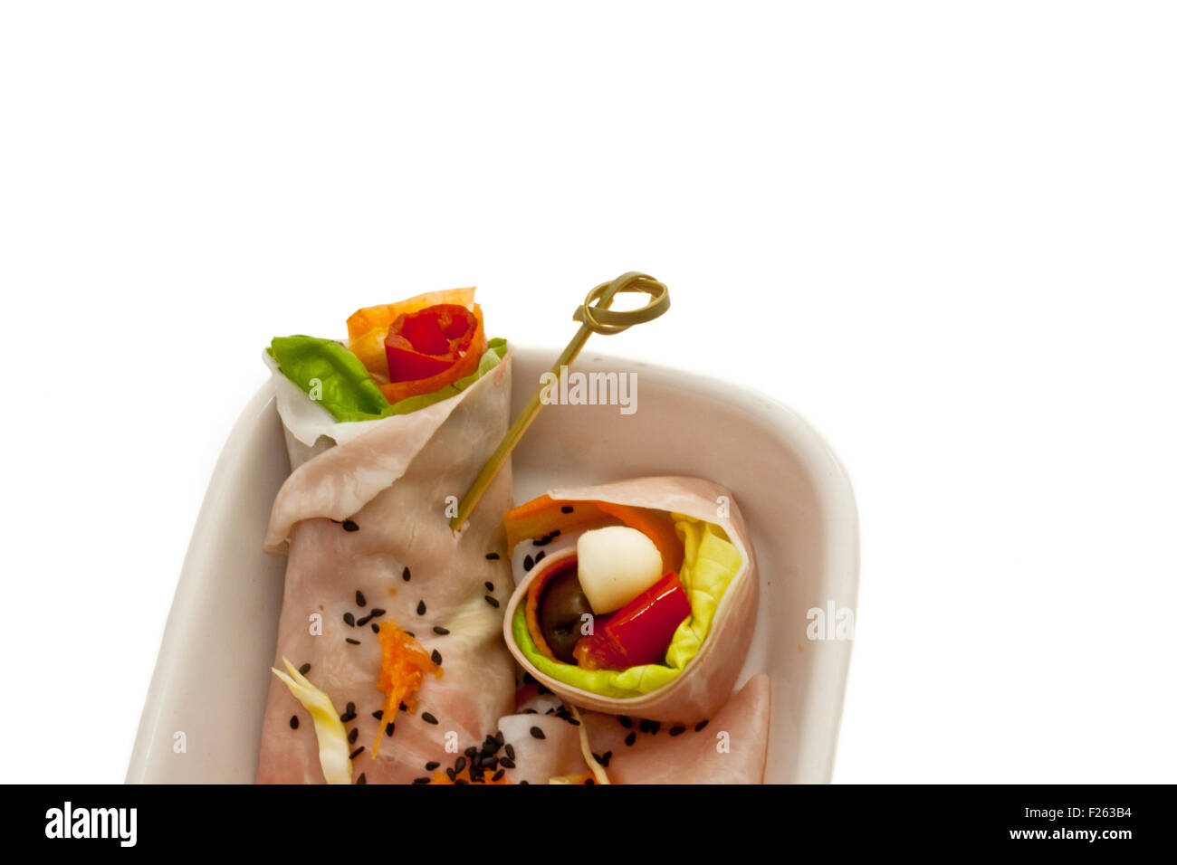 Appetizer with ham inside a saucer on a white background Stock Photo ...