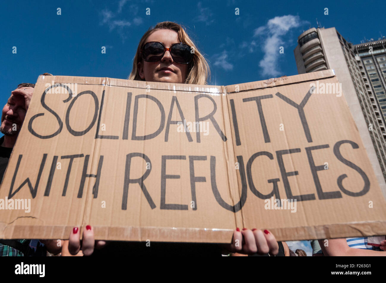 London, UK. 12 September 2015. A girl with a banner as tens of ...