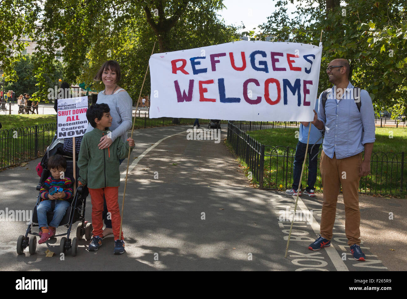 London, UK. 12th September, 2015. A Refugees Welcome poster. Tens of ...