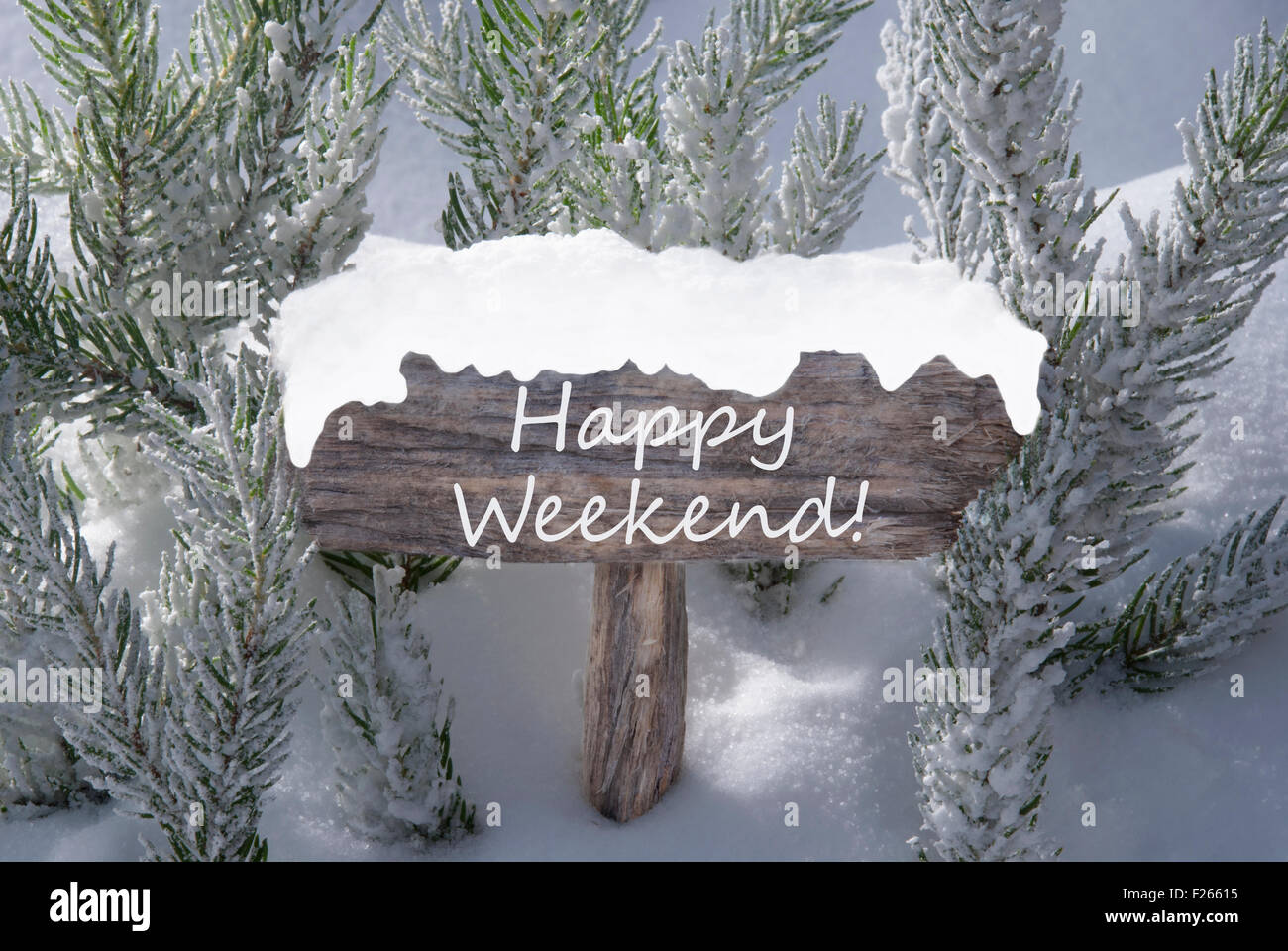Christmas Sign Snow Fir Tree Branch Text Happy Weekend Stock Photo - Alamy