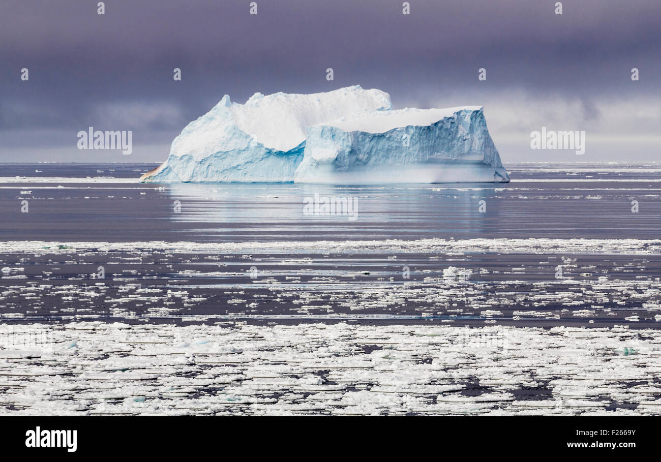 Iceberg in Antarctic winter and storm clouds at the background Stock ...