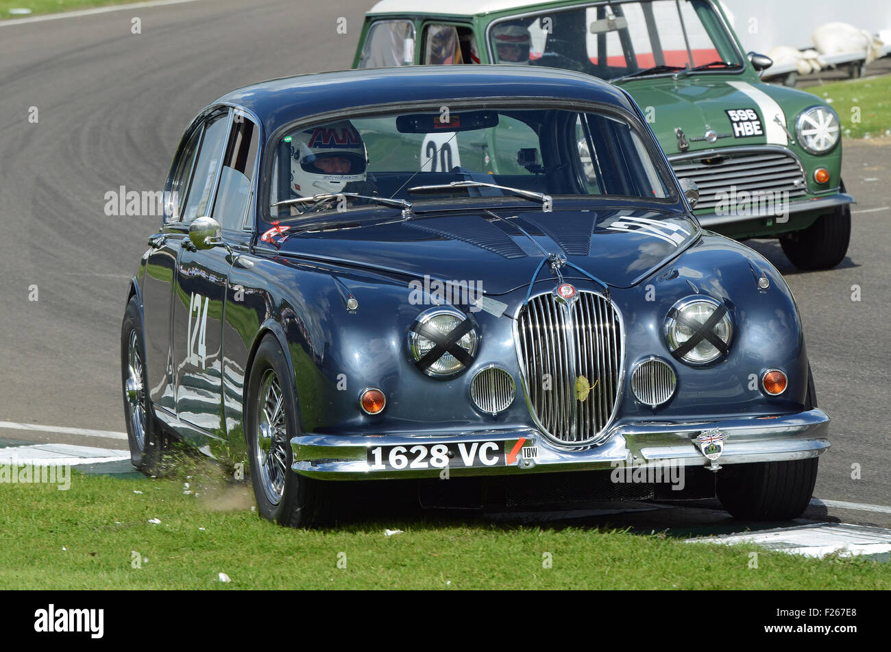 Classic Jaguar saloon car racing at Goodwood Revival 2015. Taking to ...
