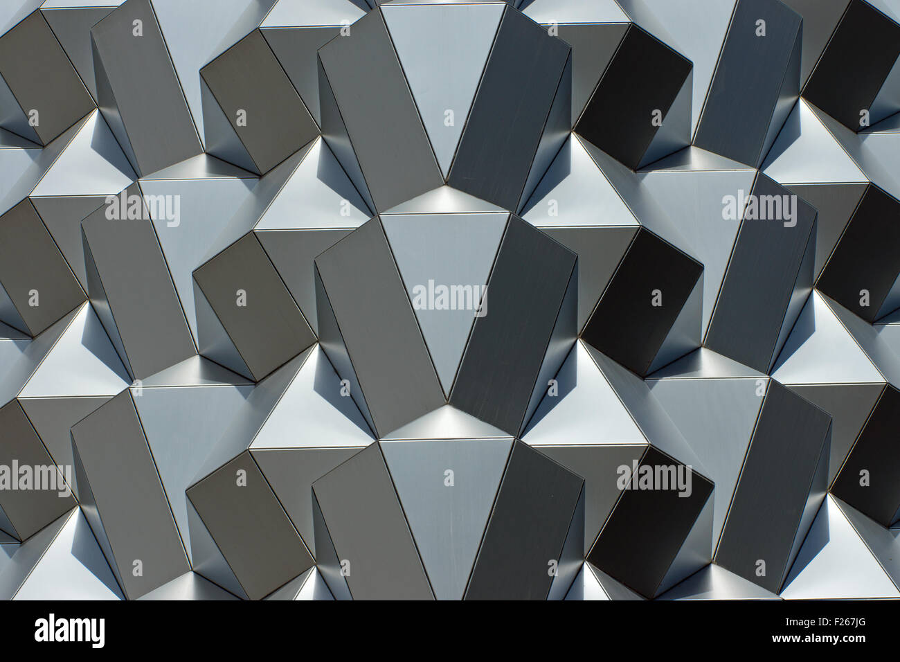 Detail of a futuristic comb-like silver facade Stock Photo - Alamy