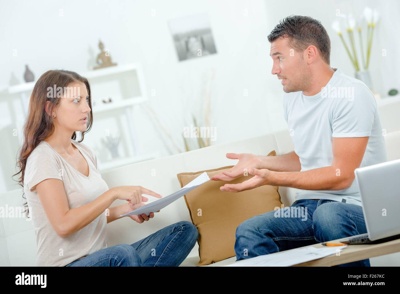 Couple arguing over bills Stock Photo - Alamy