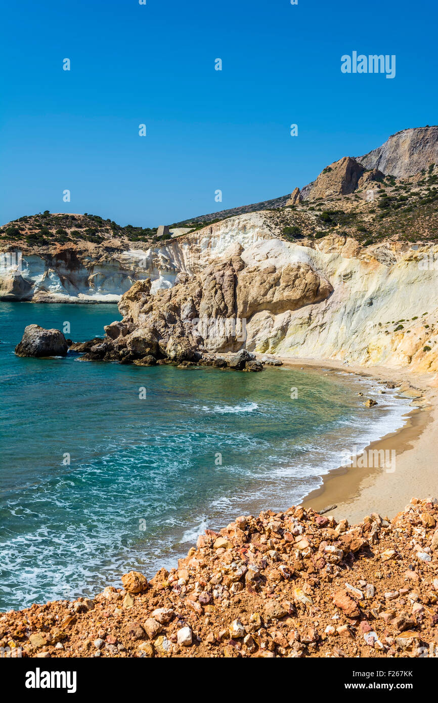 Golden beach and coastline with rocks at the Greek island of Milos ...