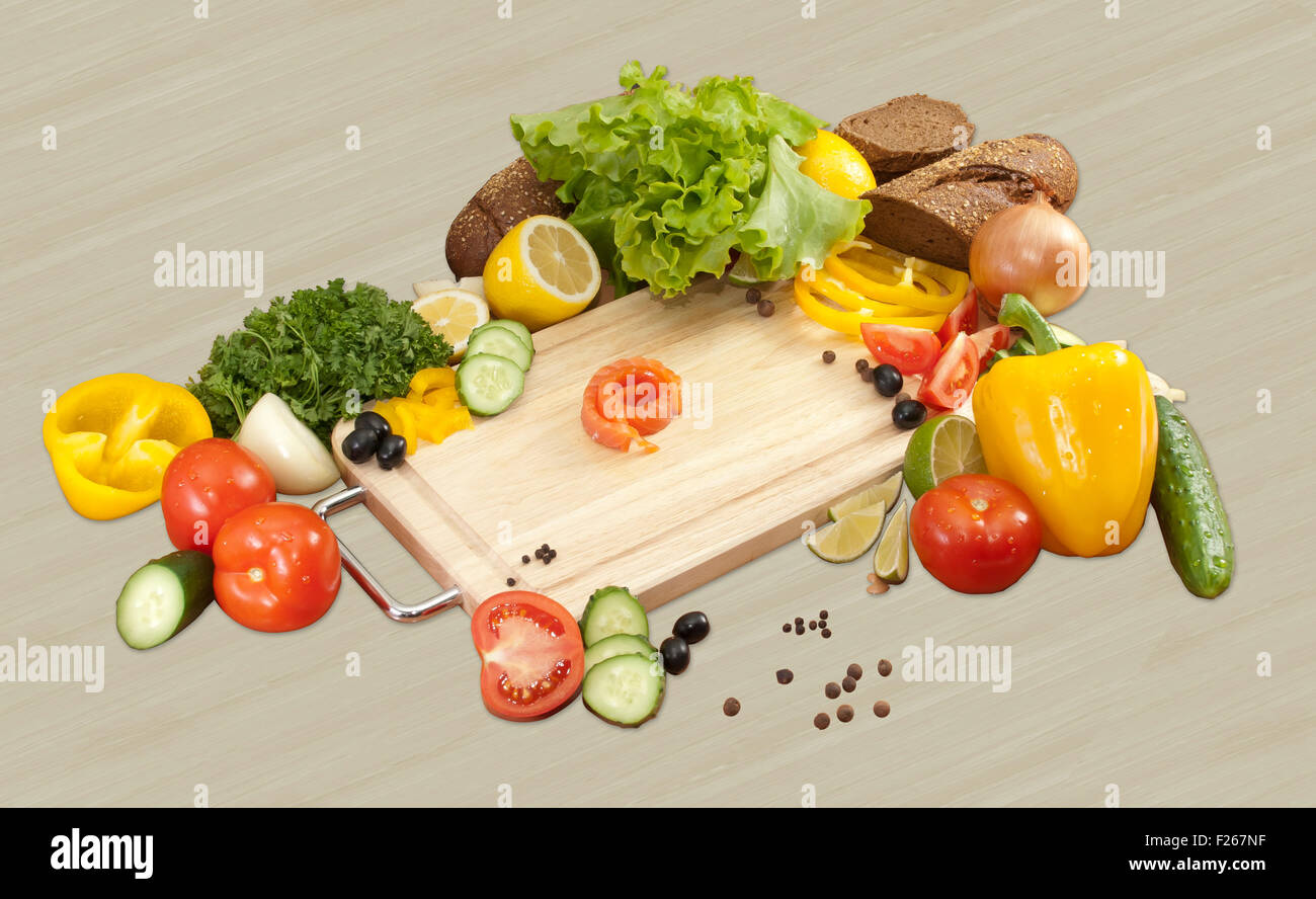 Little piece of red fish surrounded by vegetables tomatoes hi-res stock ...