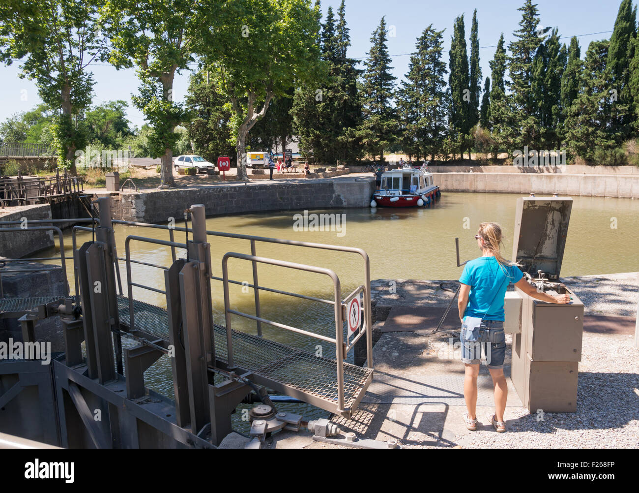 The lock keeper at Agde Round Lock, on the Canal du Midi, Hérault ...