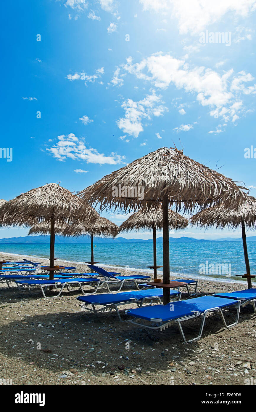Beach with empty sunbeds and parasols on Pelion Peninsula, Thessaly ...