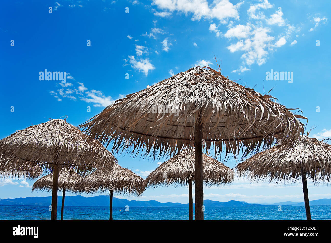 Blue sun parasols hi-res stock photography and images - Alamy