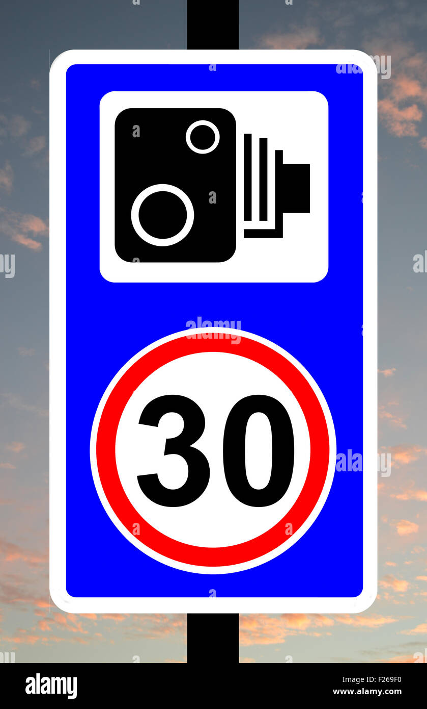 Speed camera enforcing 30mph speed limit traffic sign Stock Photo - Alamy