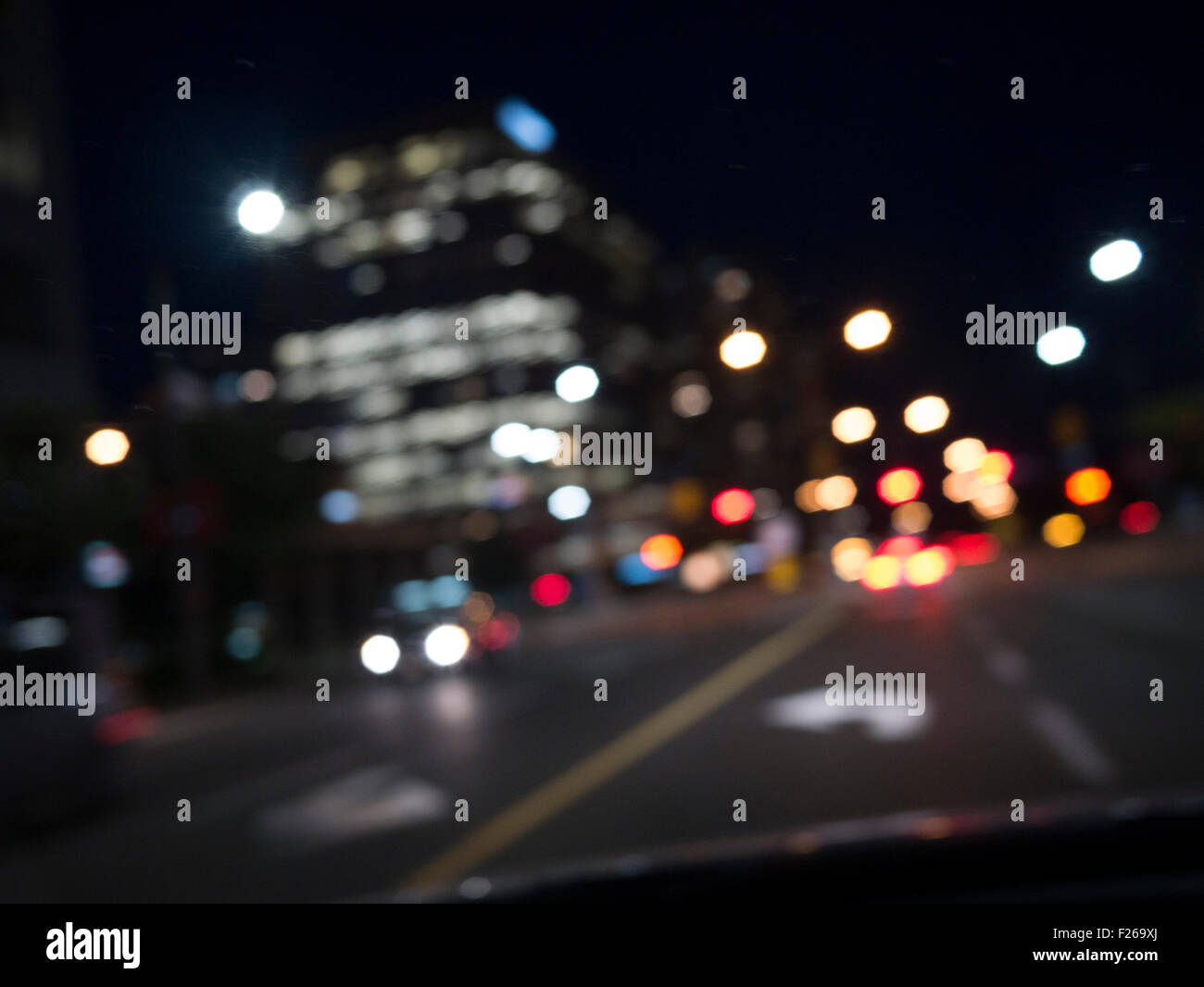 Blurred vision of a drunk driver during night drive in a city Stock ...
