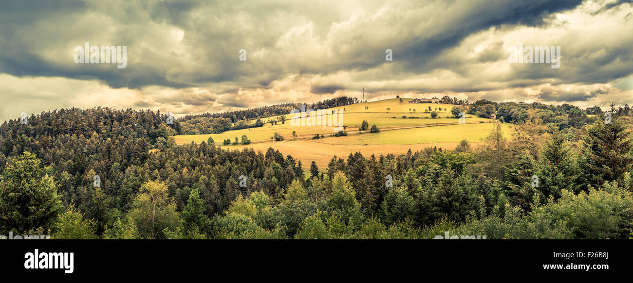 Panorama of Austrian country landscape with heavy clouds in the sky ...