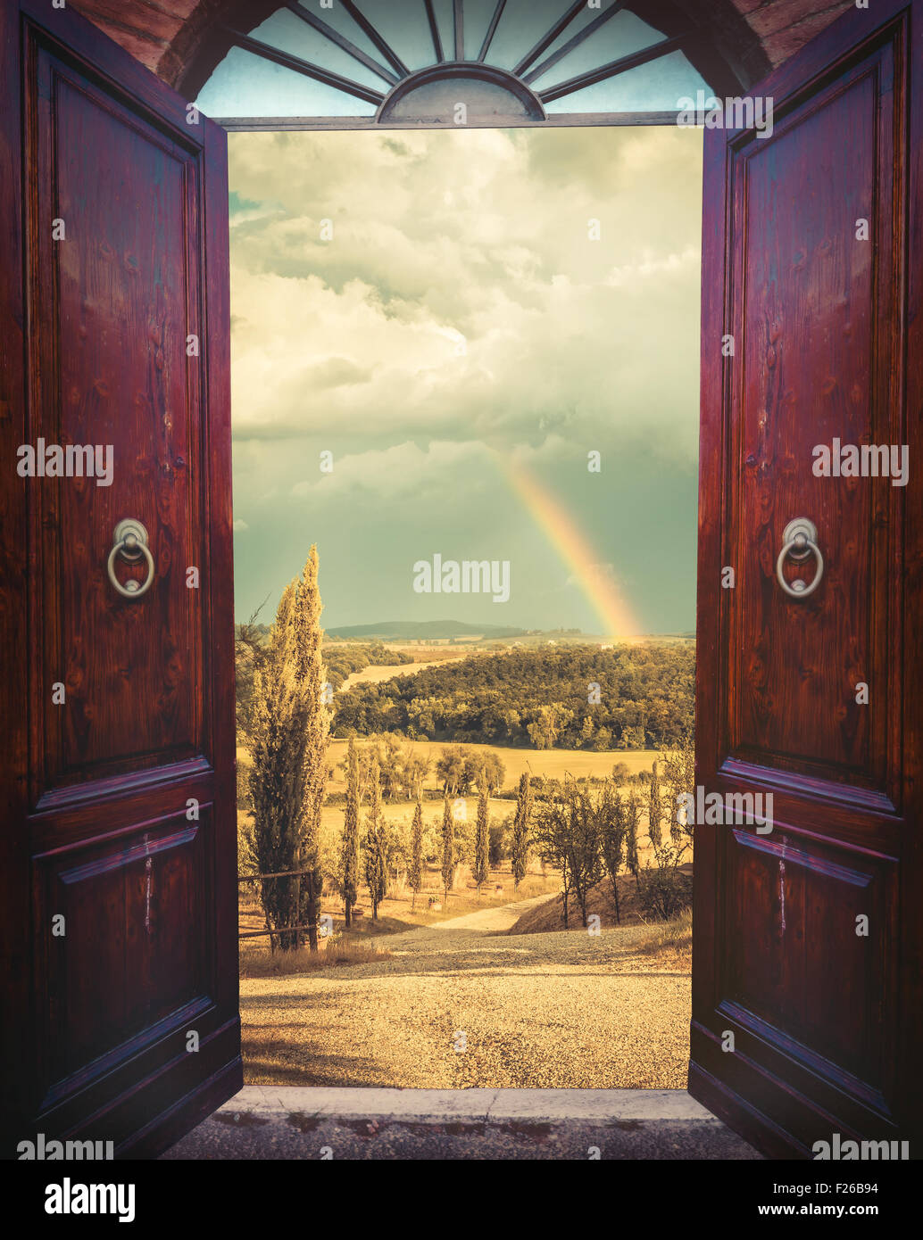 Old open door and rural landscape with rainbow Stock Photo - Alamy
