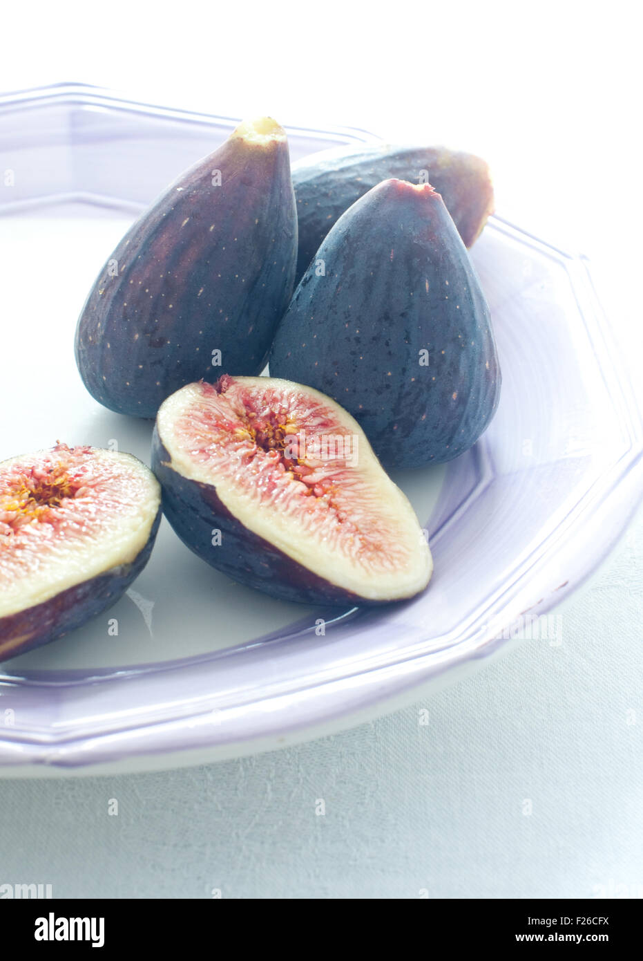 Group of colored figs on the colorful background Stock Photo - Alamy