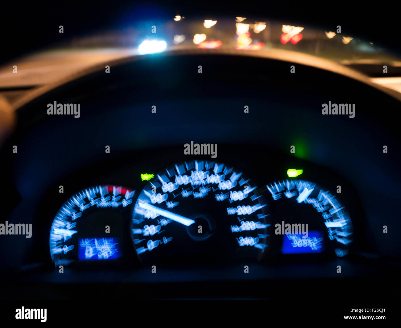 Blurred vision of a drunk driver during night drive in a city Stock ...