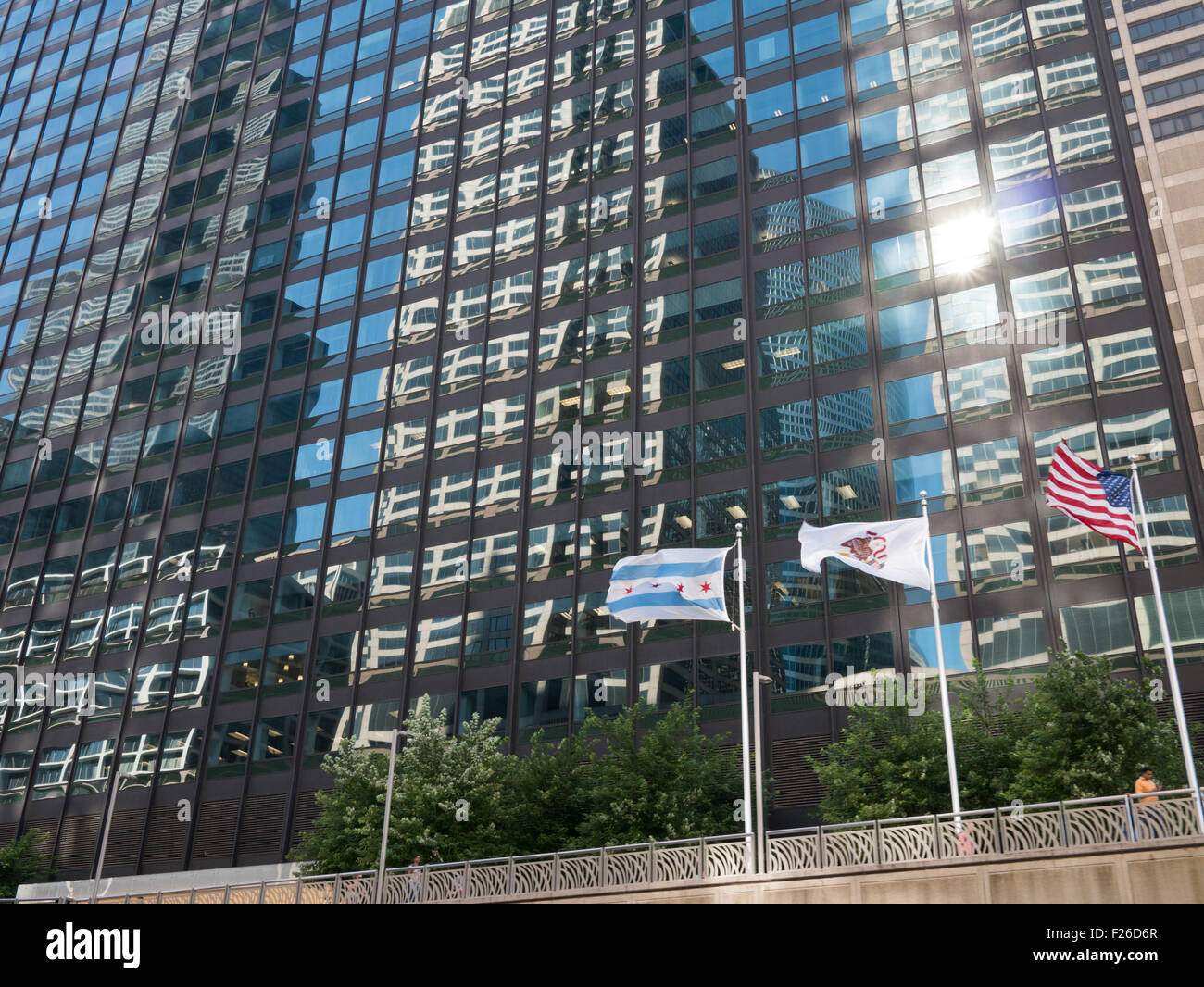 Low angle view of Chicago skyline reflection on a glass skyscraper ...