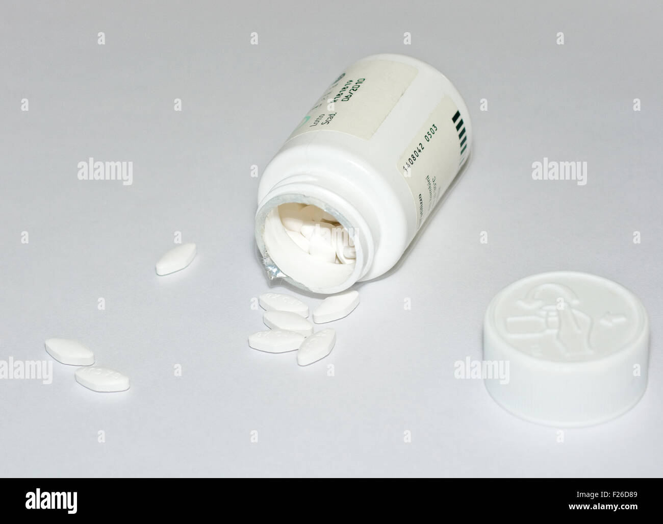 Close up of white pills inside a plastic bottle Stock Photo - Alamy