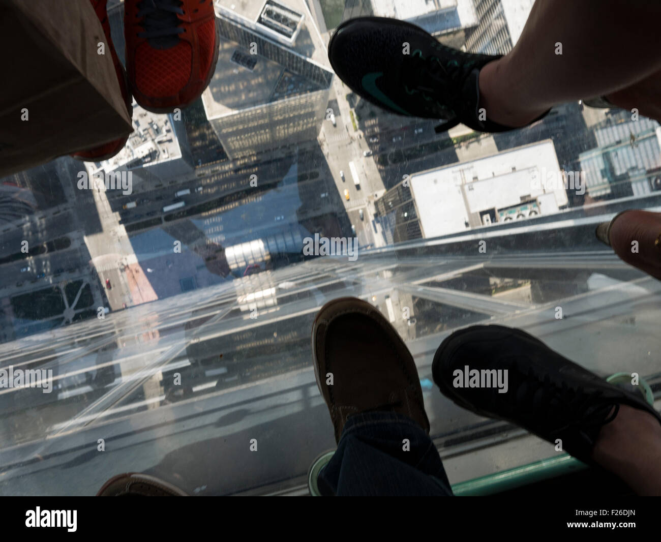 Tourists enjoying the aerial view of Chicago from Willis Tower Skyview ...