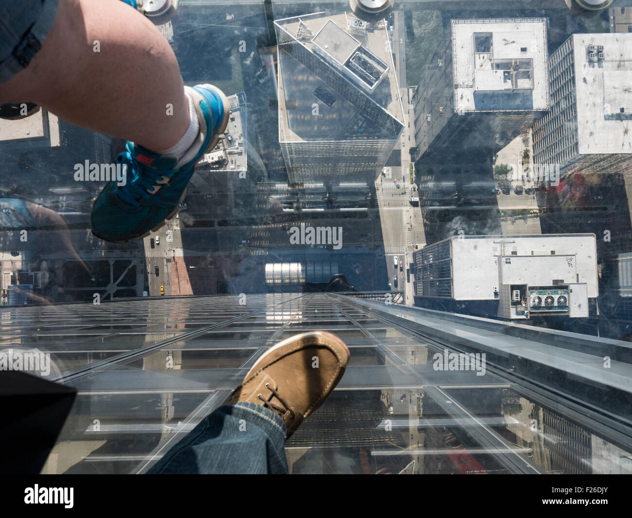 Tourists enjoying the aerial view of Chicago from Willis Tower Skyview ...