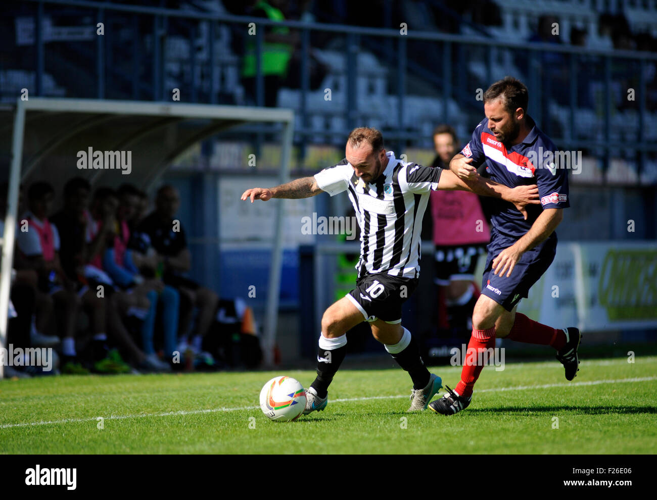 Dorchester, England. 12th September 2015. Ben Watson DTFC (left) takes ...