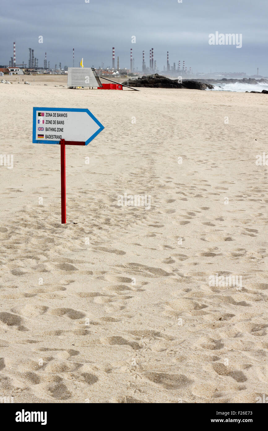 Urban beach scene with "swim area" sign Stock Photo - Alamy