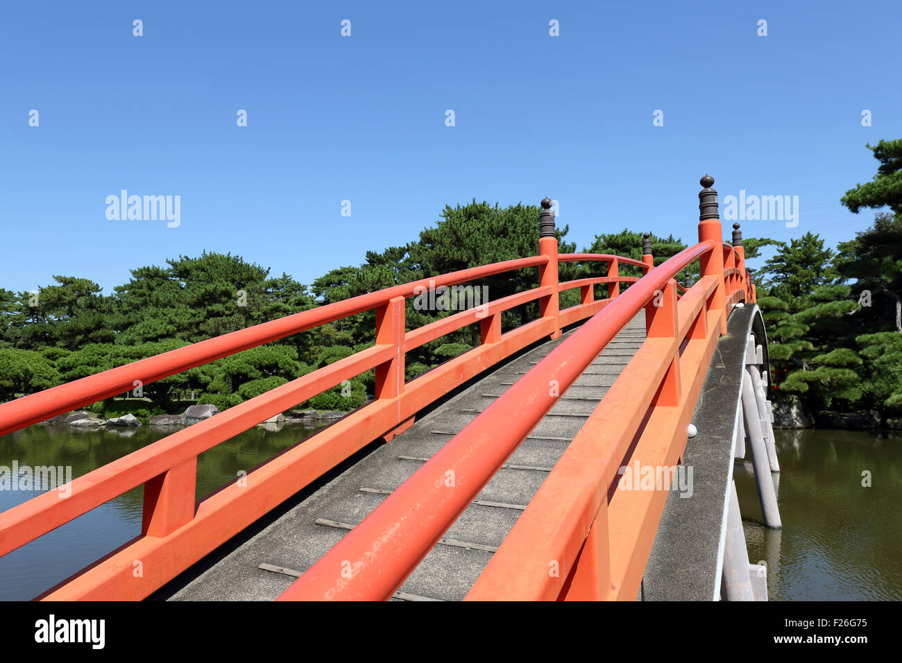 Red walking bridge in Japanese park Stock Photo - Alamy