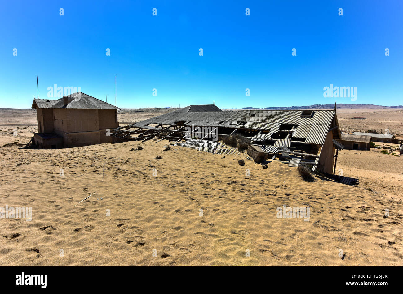 The abandoned ghost diamond town of Kolmanskop in Namibia, which is ...