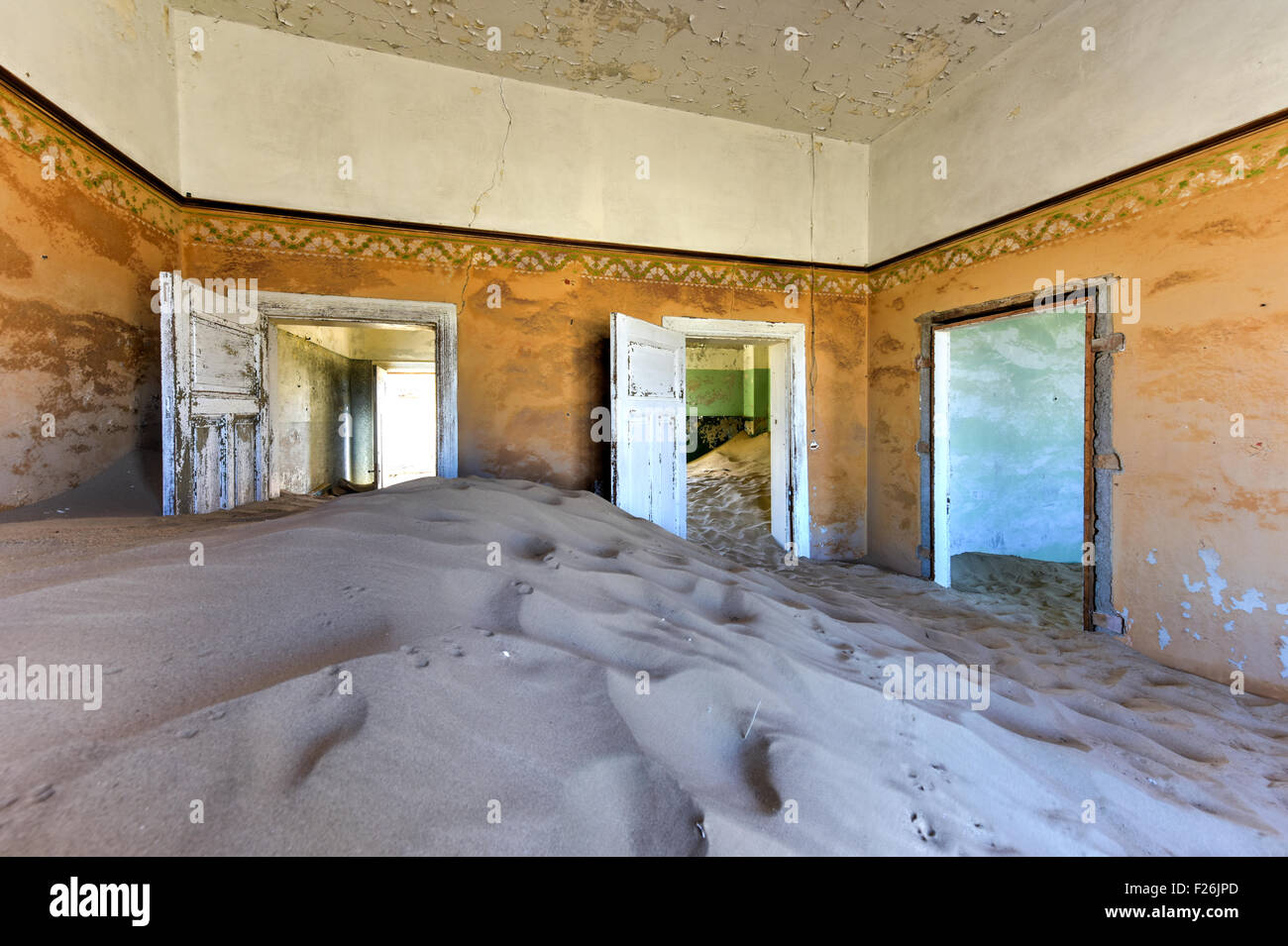 The abandoned ghost diamond town of Kolmanskop in Namibia, which is ...