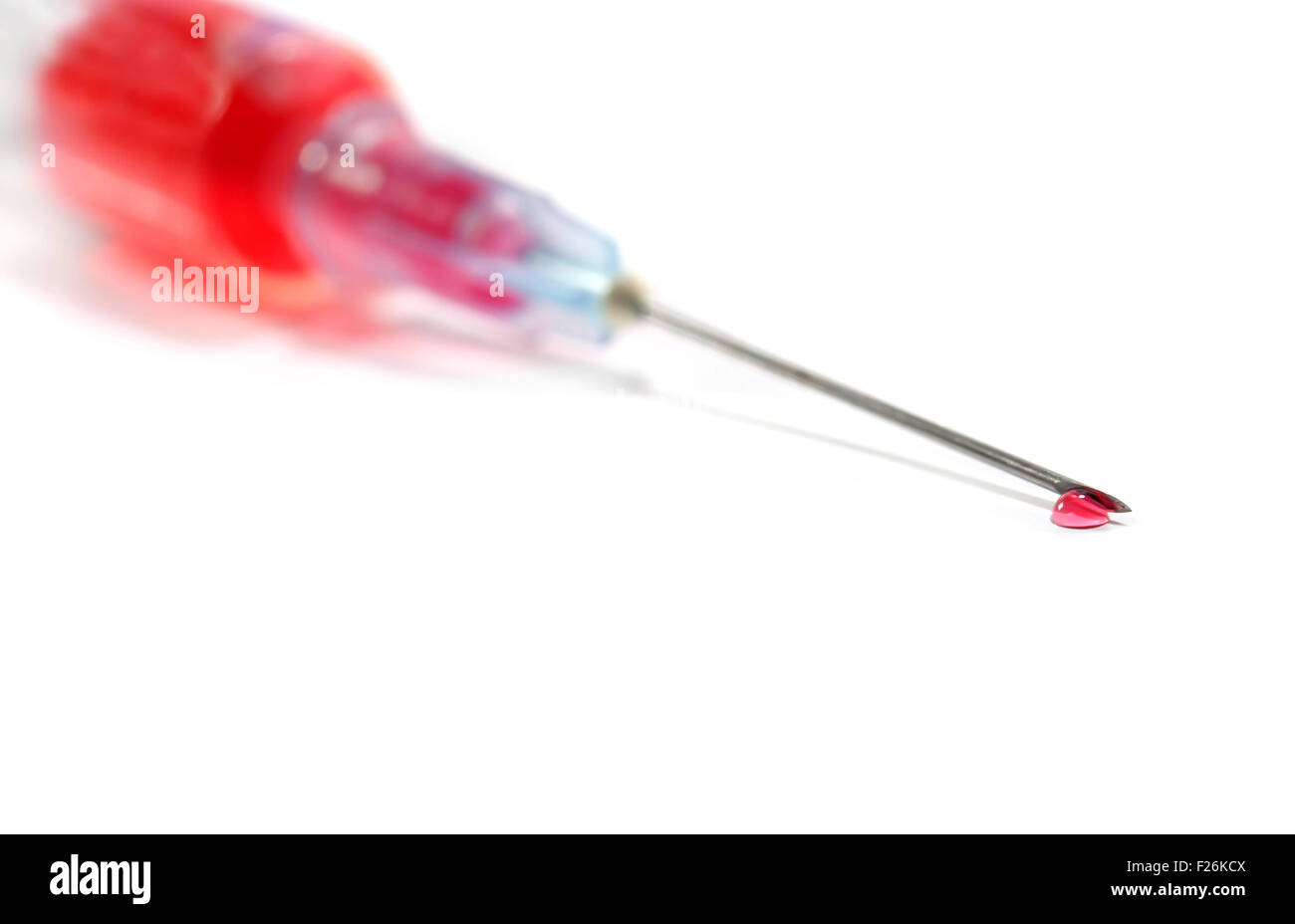 red liquid medicine in syringe isolated on white background Stock Photo ...