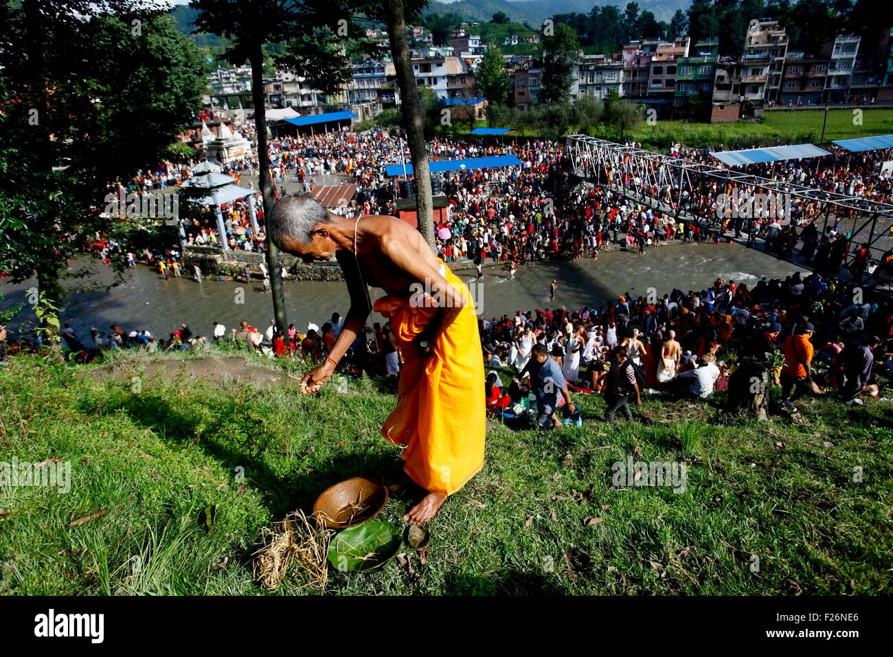 Kathmandu, Nepal. 13th Sep, 2015. A Hindu devotee prepares Kush, a holy ...