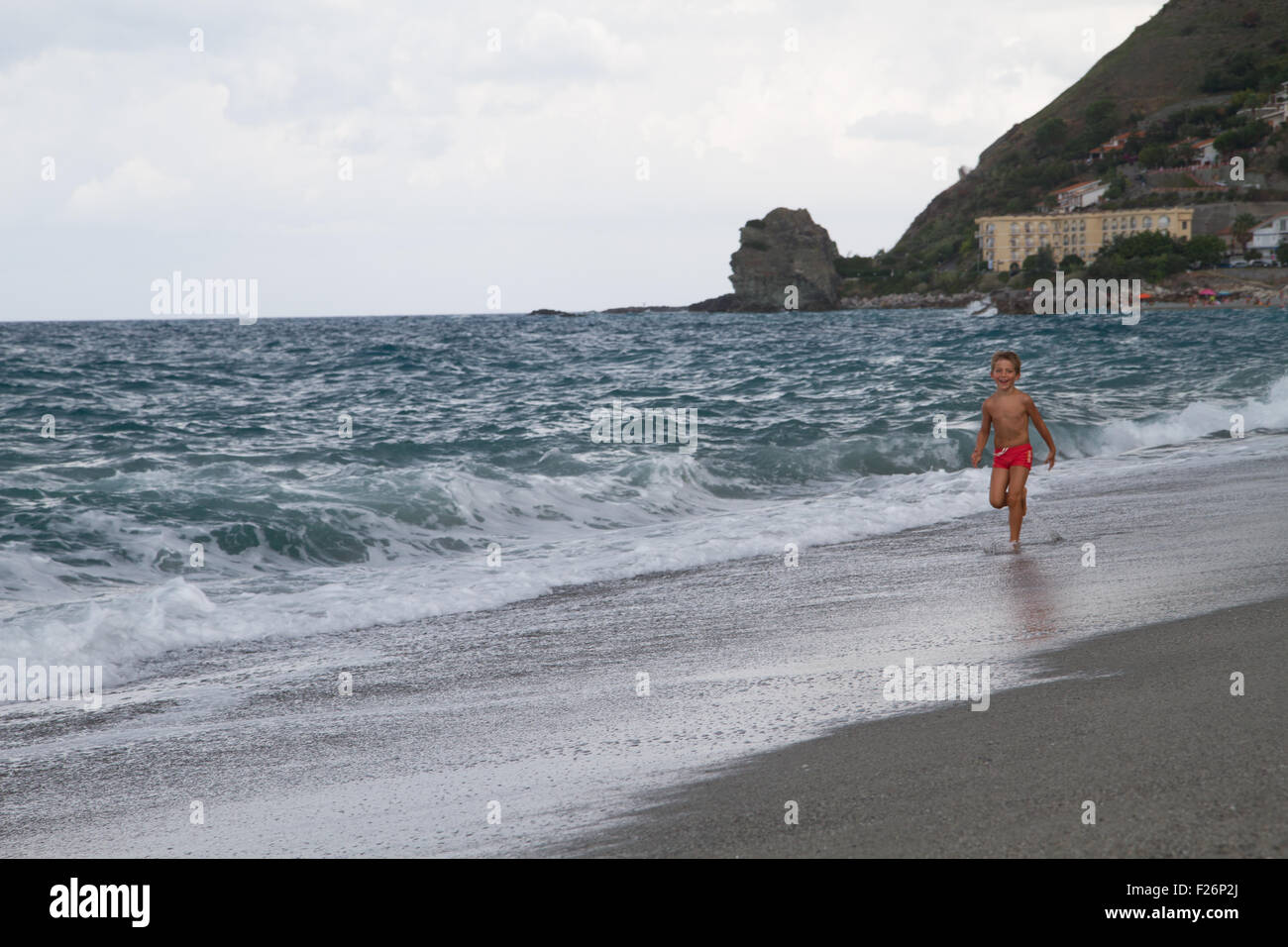 Running in the waves hi-res stock photography and images - Alamy