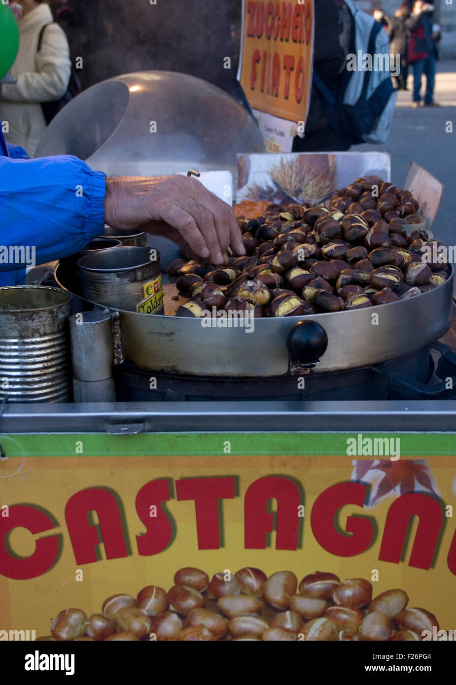 Freshly roasted chestnuts inside a iron plate Stock Photo - Alamy
