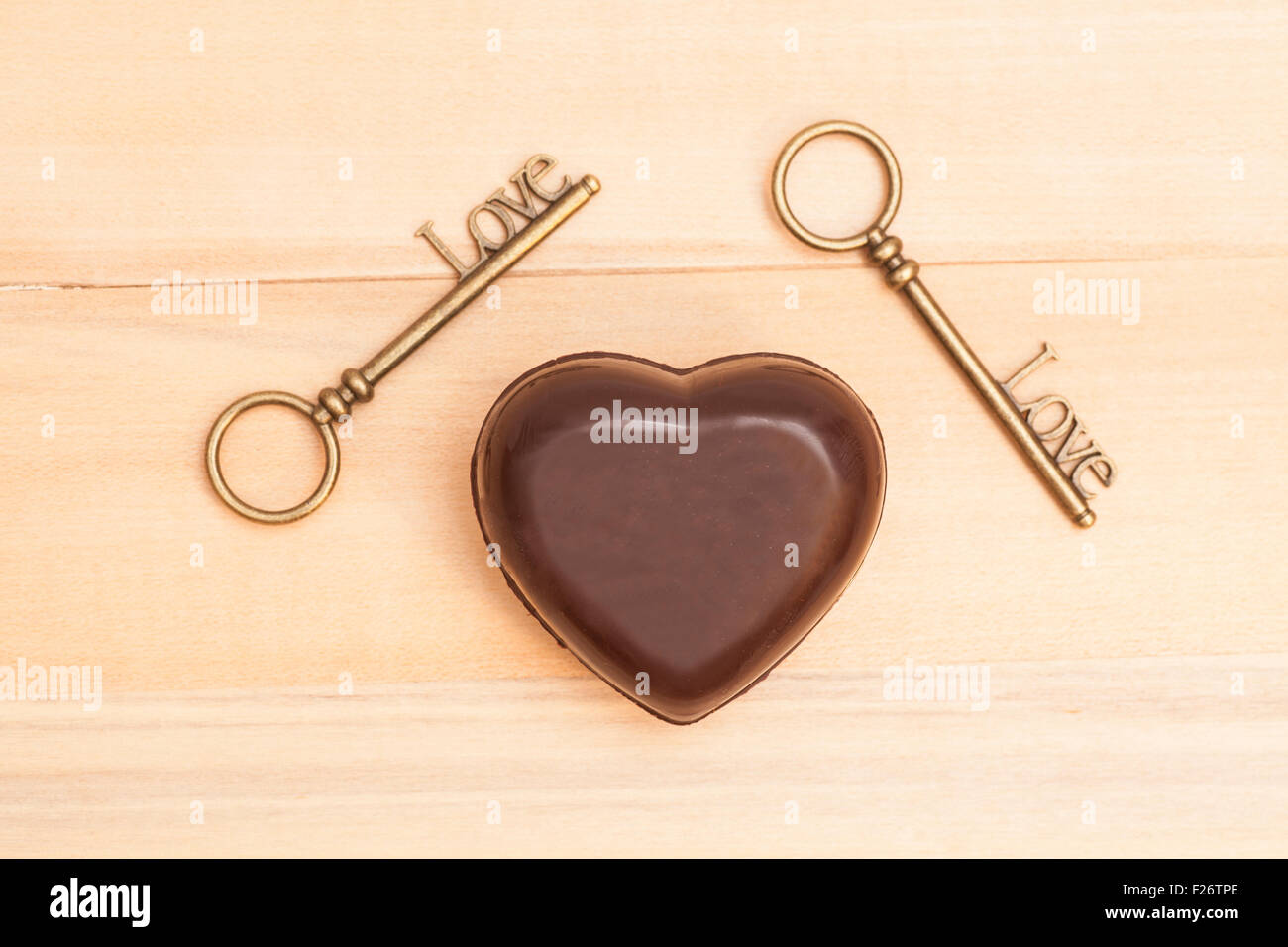 Heart and Keys for love on wooden background Stock Photo - Alamy