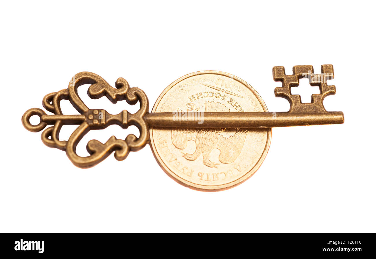 Key to success on coin isolated on white Stock Photo - Alamy